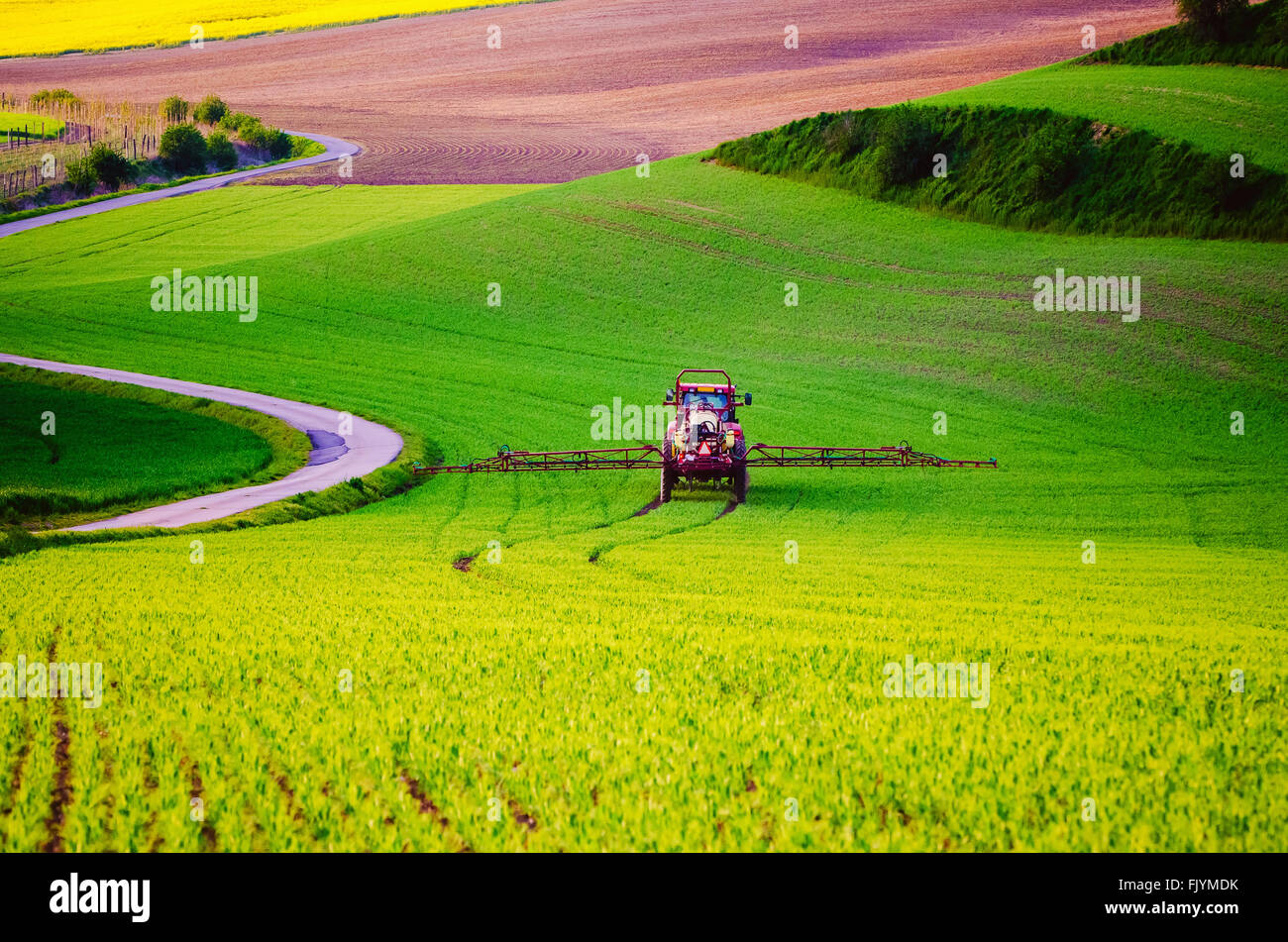 Farm machinery spraying insecticide Stock Photo - Alamy