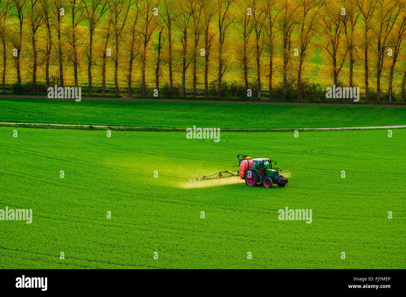 Farm machinery spraying insecticide Stock Photo - Alamy