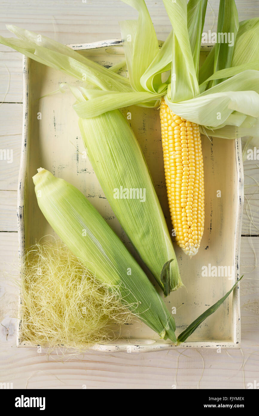 Fresh corn cobs on wooden tray Stock Photo - Alamy