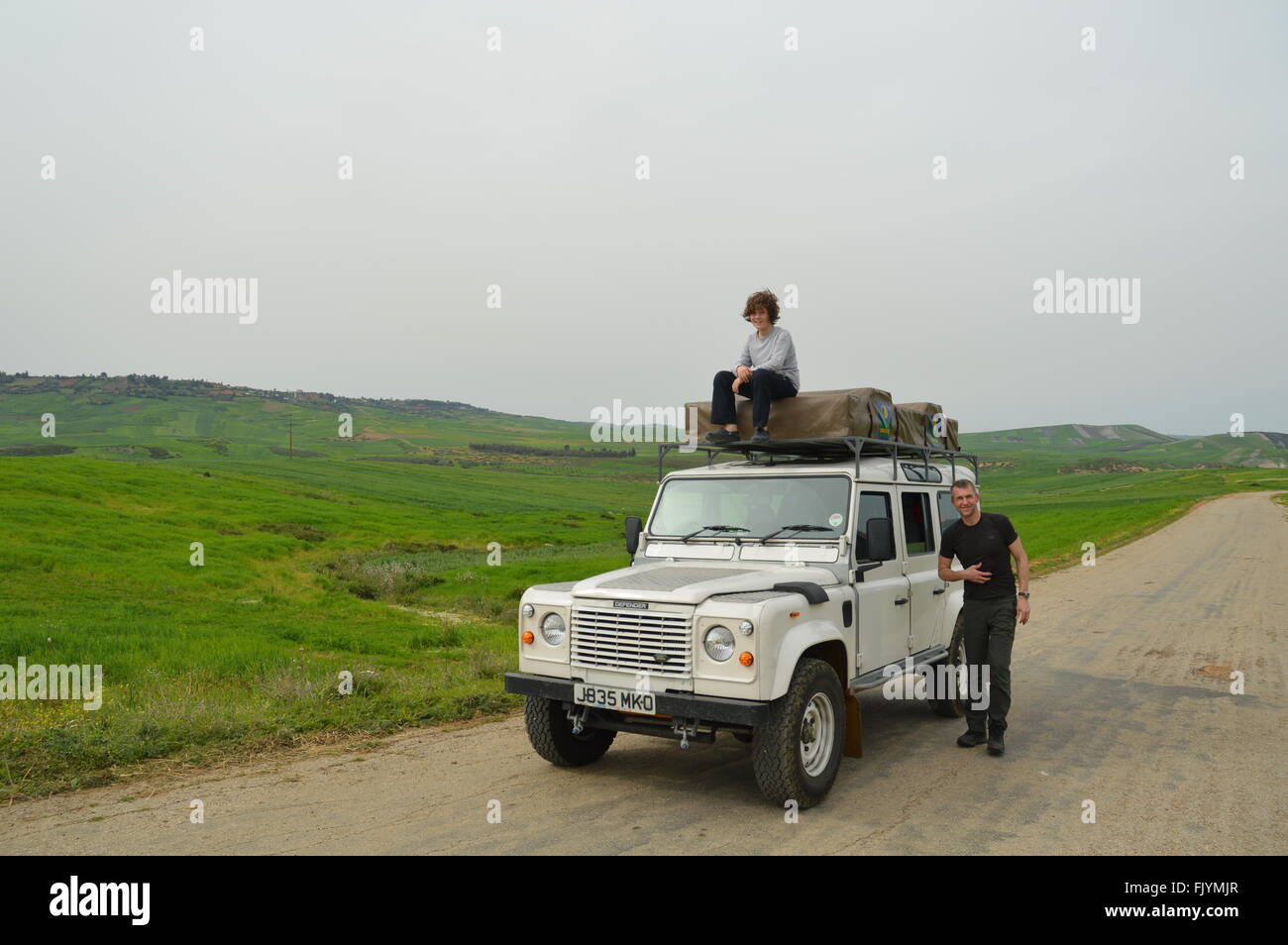 Family Adventure! Boy on roof land rover Stock Photo - Alamy