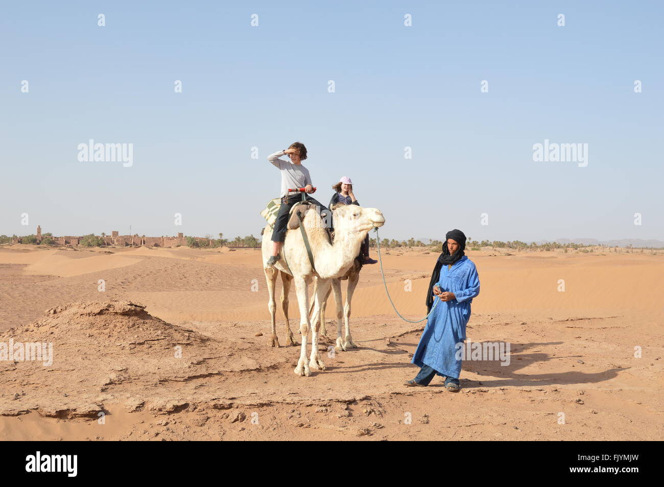 Boy riding camel in hi-res stock photography and images - Alamy