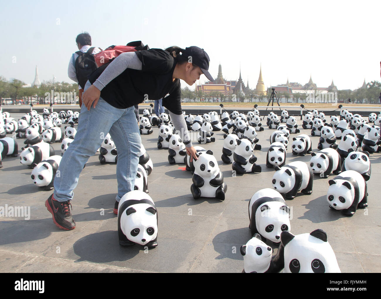 Bangkok, Thailand. 04th Mar, 2016. A woman touches a panda during 1600 ...