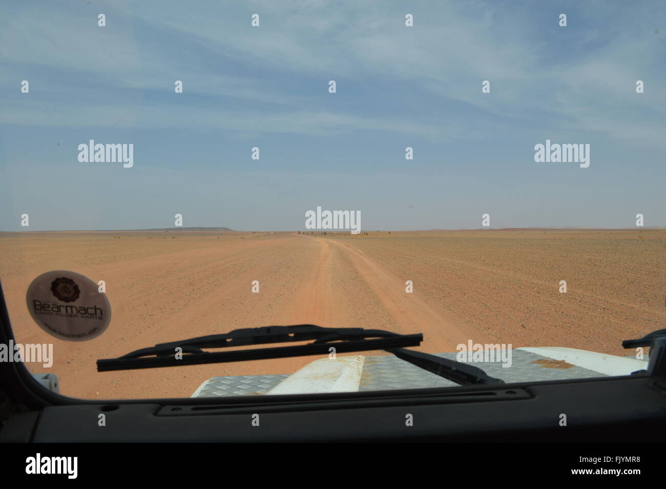 Driving Land Rover Defender in Sahara Stock Photo - Alamy