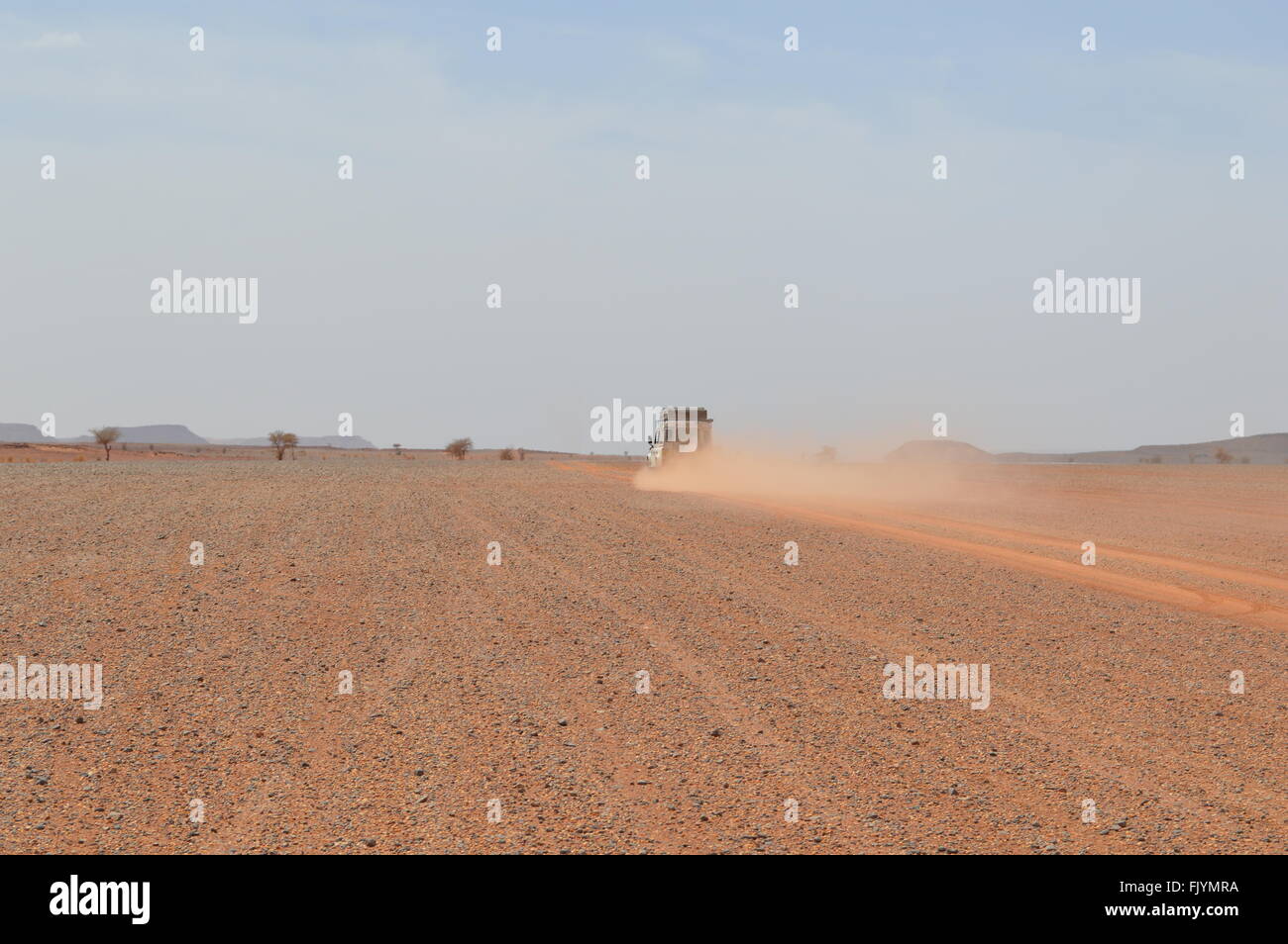 Driving Land Rover Defender in Sahara Stock Photo - Alamy