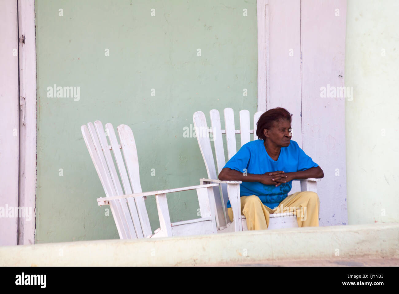 Daily life in Cuba - Cuban woman sitting in traditional rocking chair ...