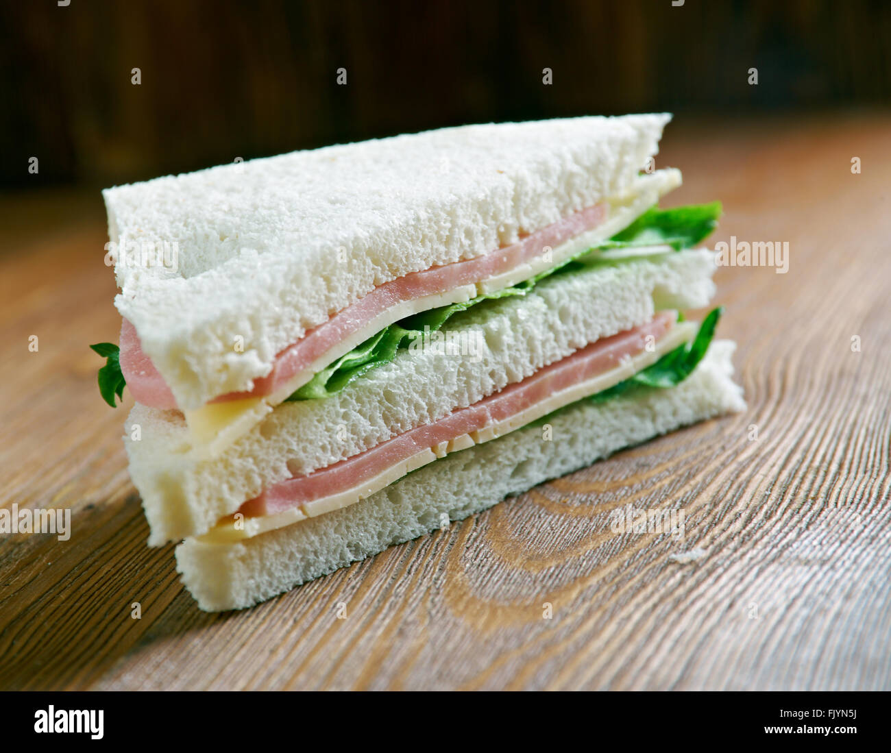 Tramezzino triangular sandwich constructed from two slices of soft ...
