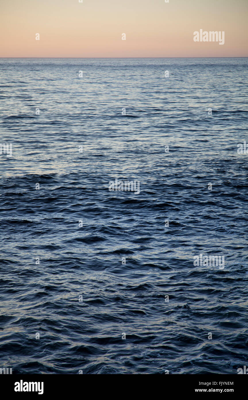 Gentle Sunset On Rippling Ocean Stock Photo - Alamy