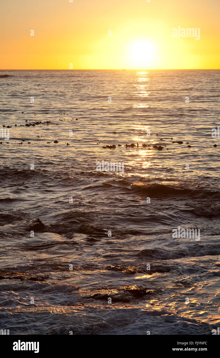 Sunset over Ocean Waves Stock Photo - Alamy