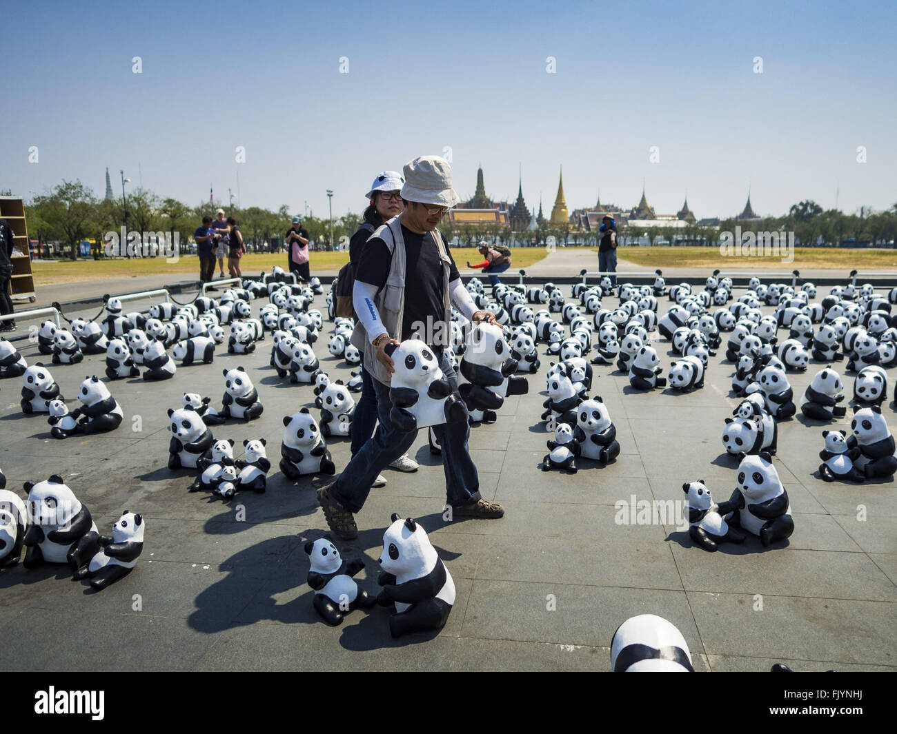 Bangkok, Bangkok, Thailand. 4th Mar, 2016. A panda wrangler carries a ...