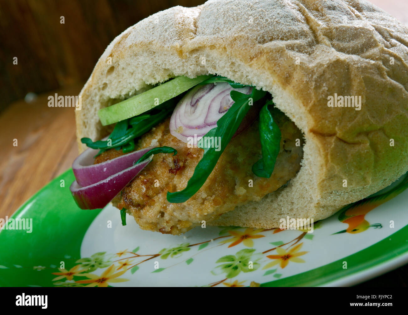 Balkan Burger with lettuce served .close up Stock Photo - Alamy