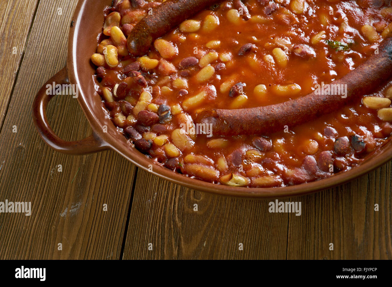 Tavche gravche traditional Macedonian dish.Baked beans with sausage ...