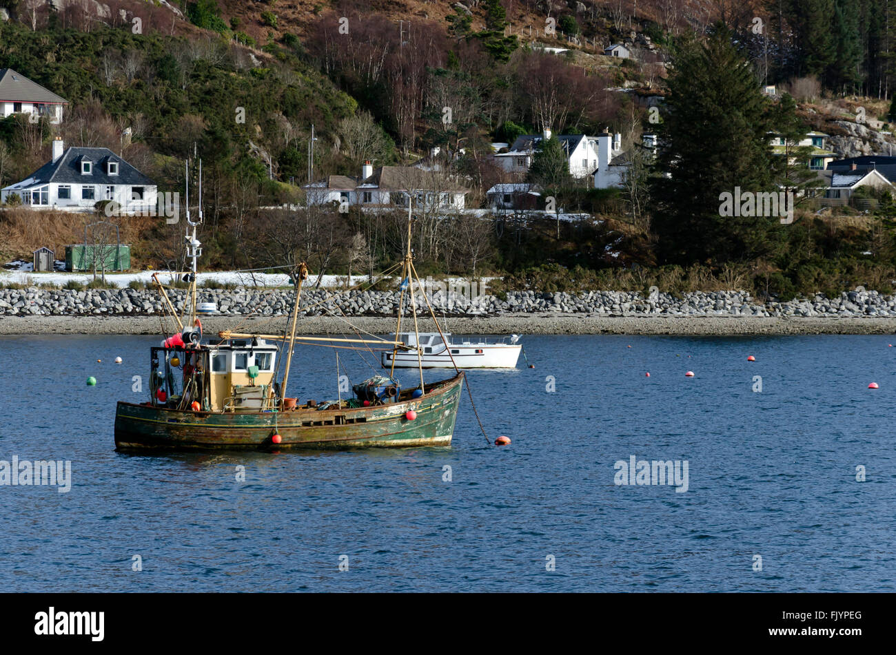 Small fishing trawler moored off Ullapool Harbour in the Western ...