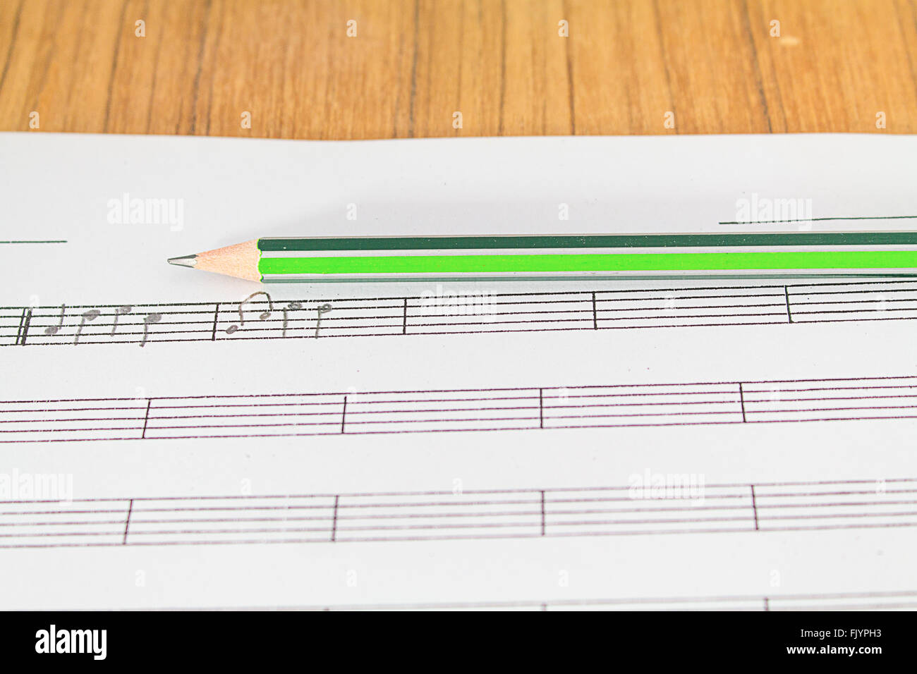 Music notes and pencil handwritten paper melody Stock Photo - Alamy