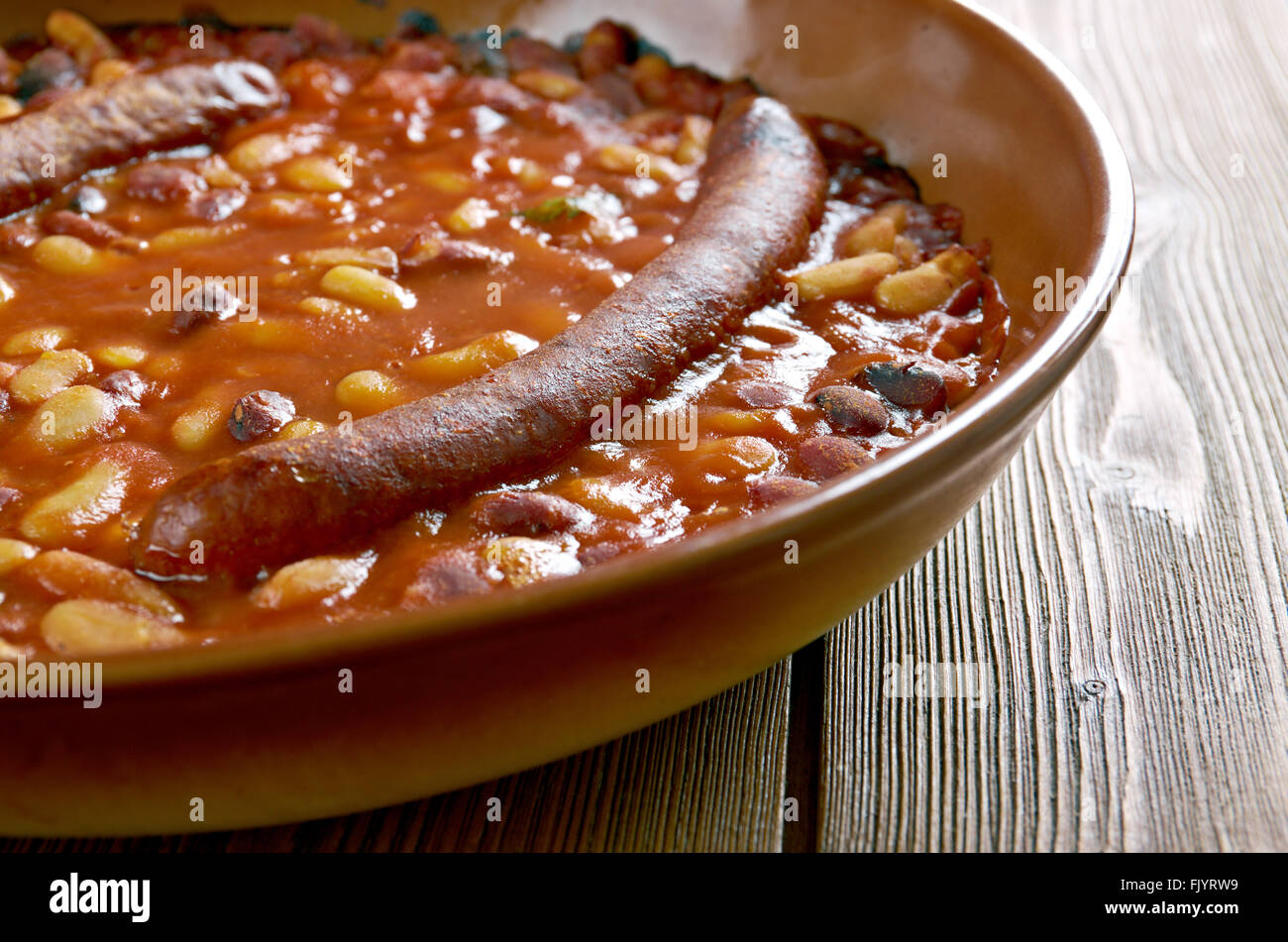 Tavche gravche traditional Macedonian dish.Baked beans with sausage ...