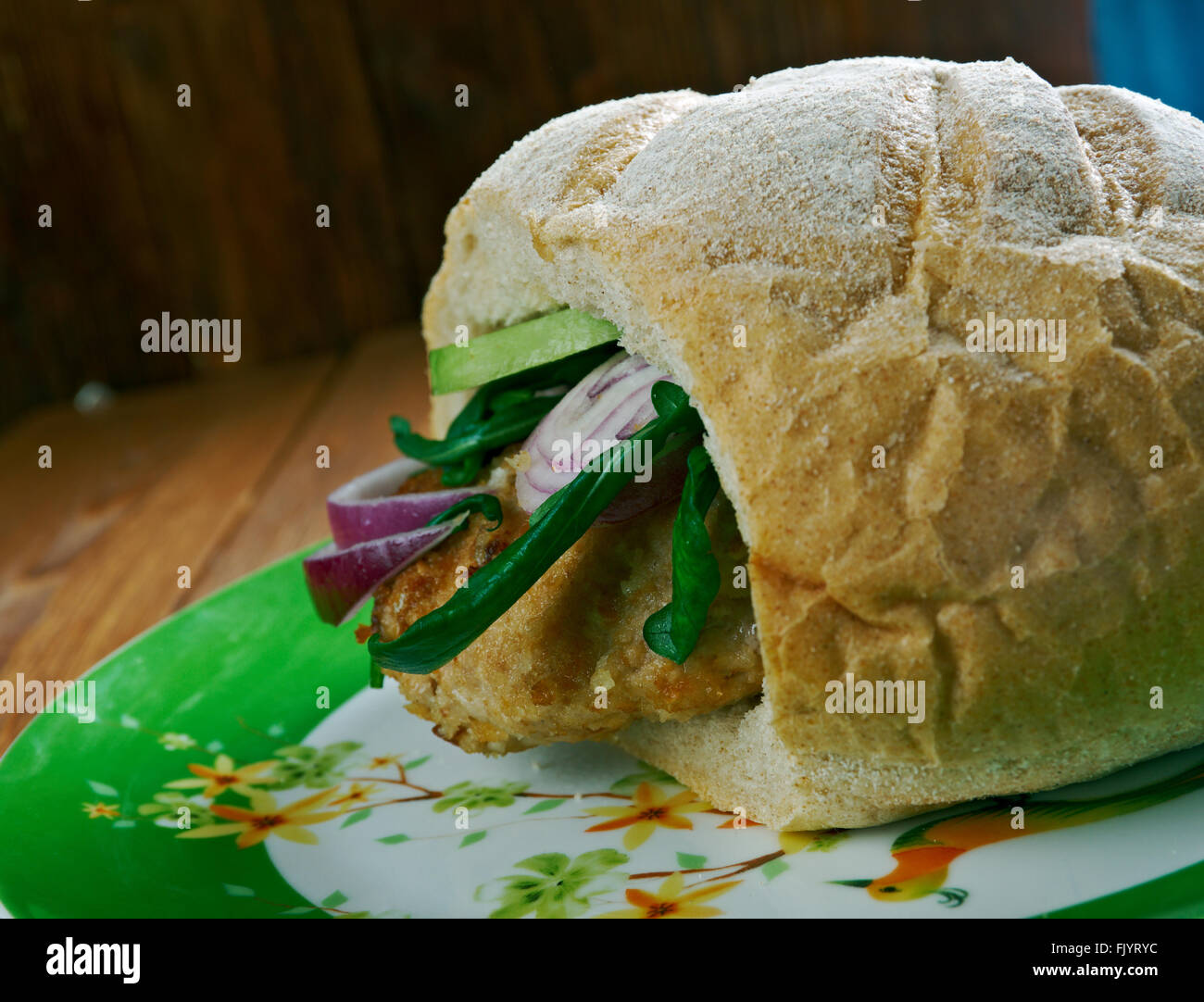 Balkan Burger with lettuce served .close up Stock Photo - Alamy