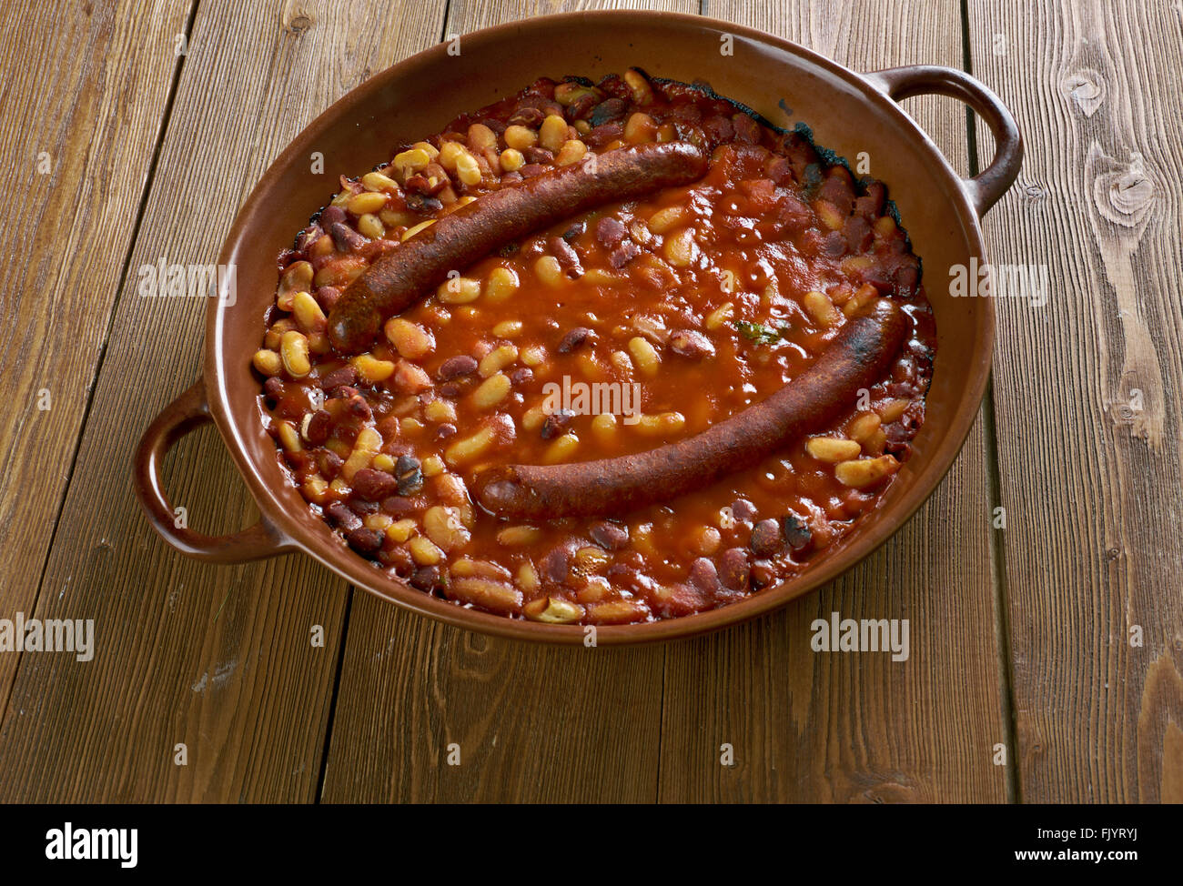 Tavche gravche traditional Macedonian dish.Baked beans with sausage ...