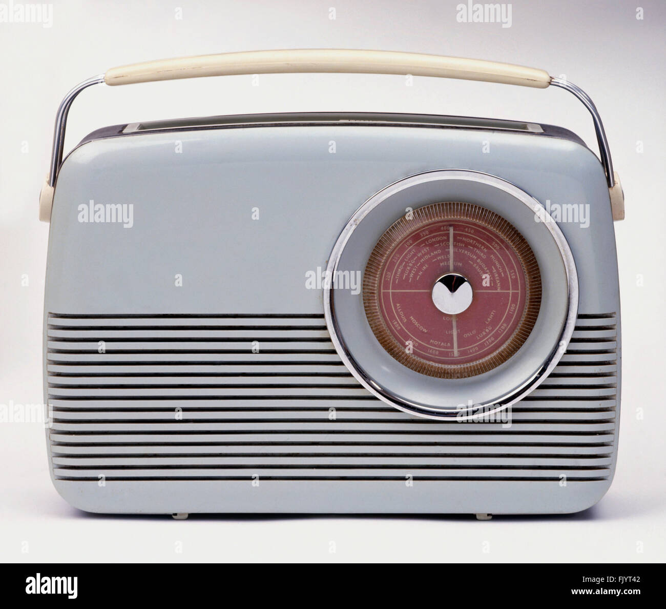 Old fashioned grey plastic and metal portable radio with handle Stock ...