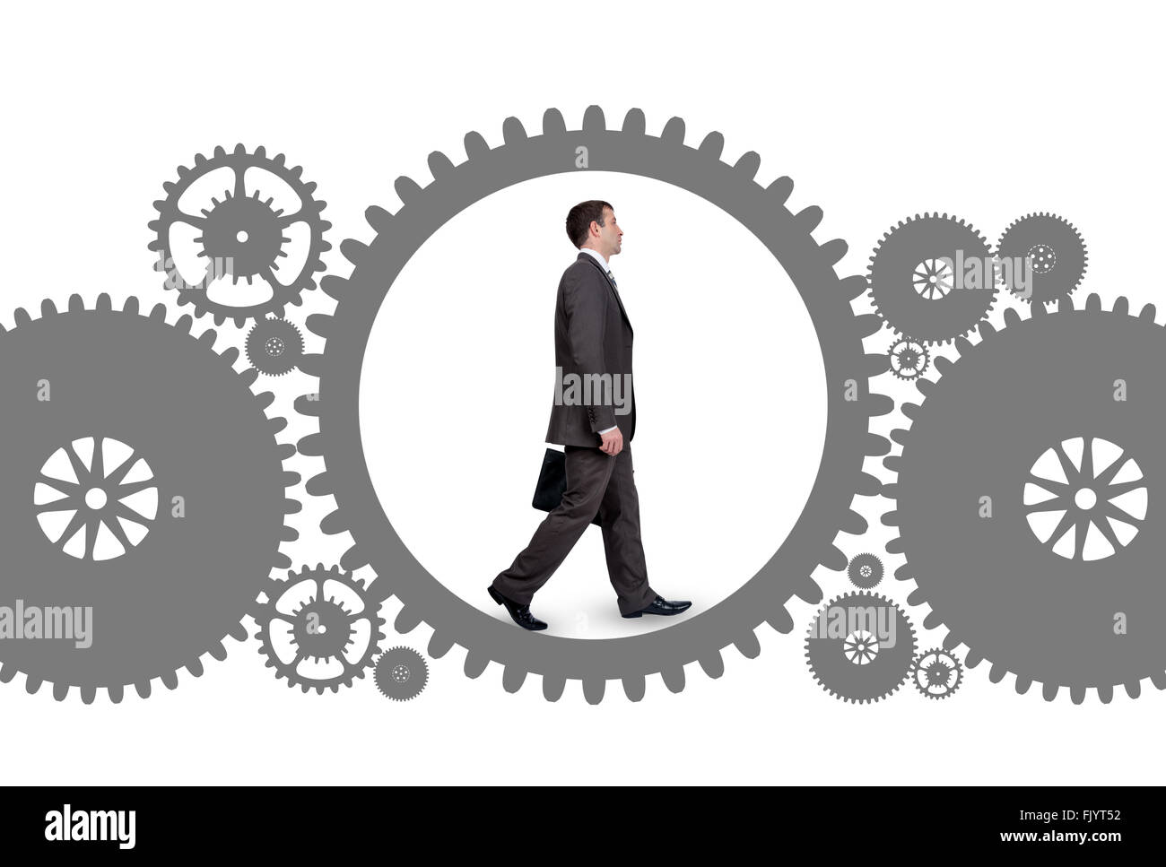Businessman walking inside gear Stock Photo - Alamy