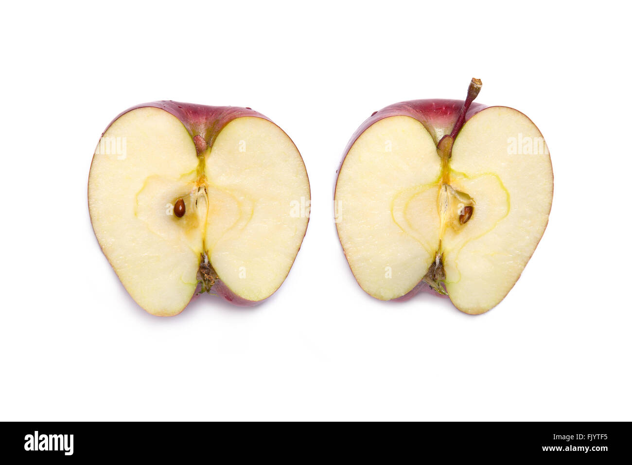 Red delicious apple cut in half, top view isolated on white background ...