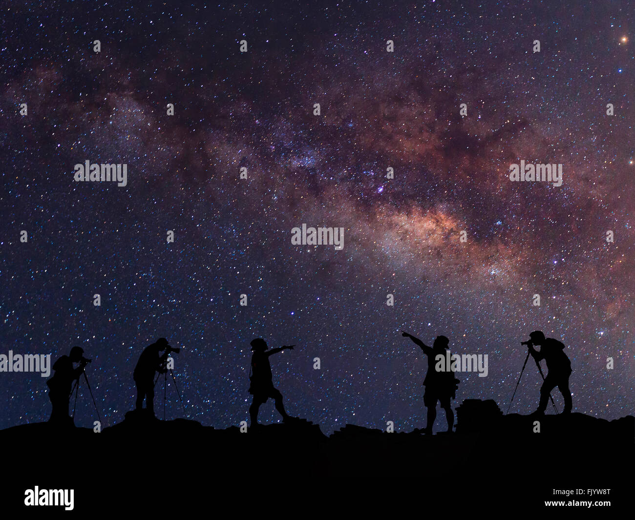 Star-catcher. A person is standing next to the Milky Way galaxy ...