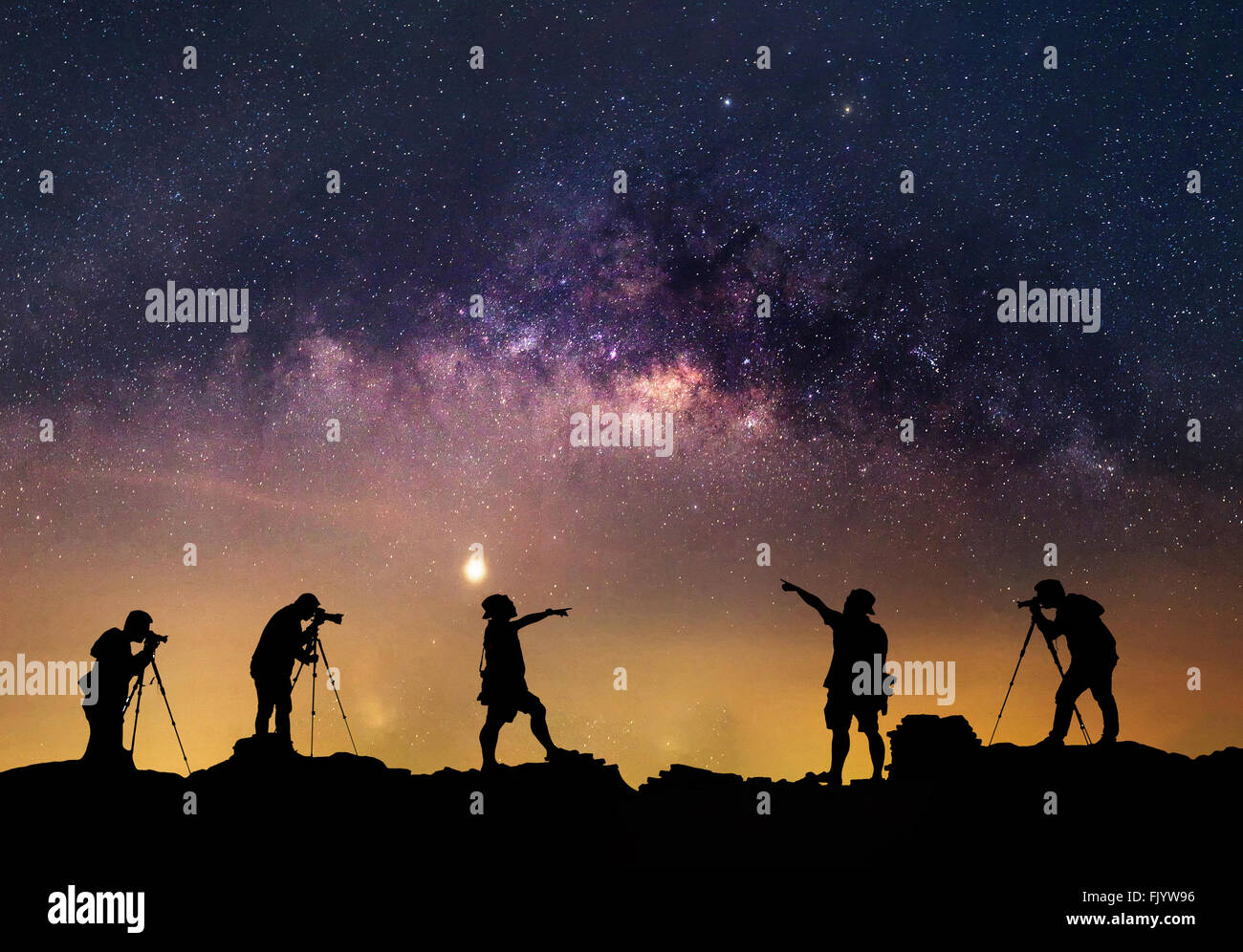 Star-catcher. A person is standing next to the Milky Way galaxy ...