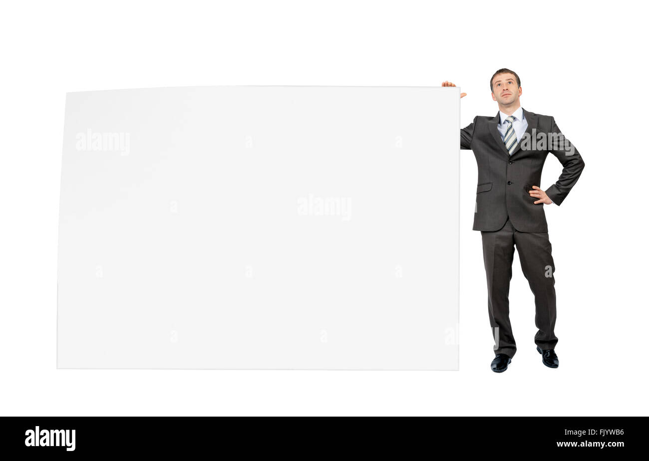 Businessman with big white paper Stock Photo - Alamy