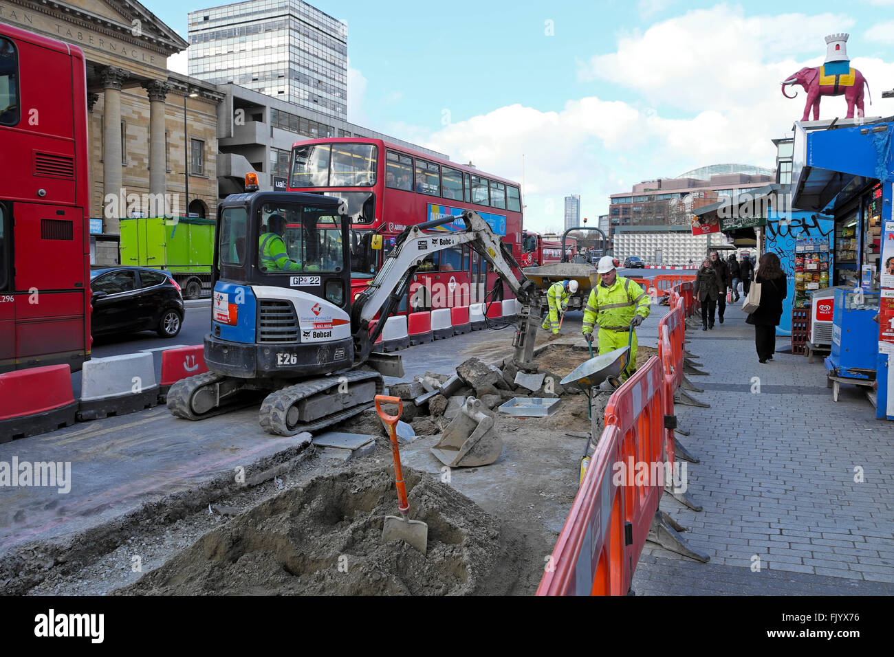 Roadworks, workmen & traffic at the Elephant & Castle in London UK ...
