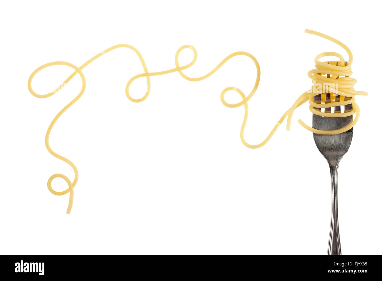 Swirls of cooked spaghetti with fork Stock Photo - Alamy