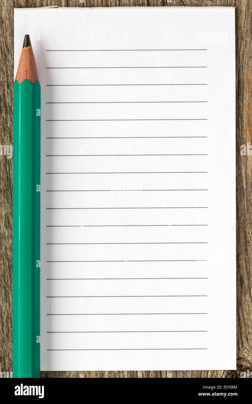 Pencil and blank lined paper for your text Stock Photo - Alamy