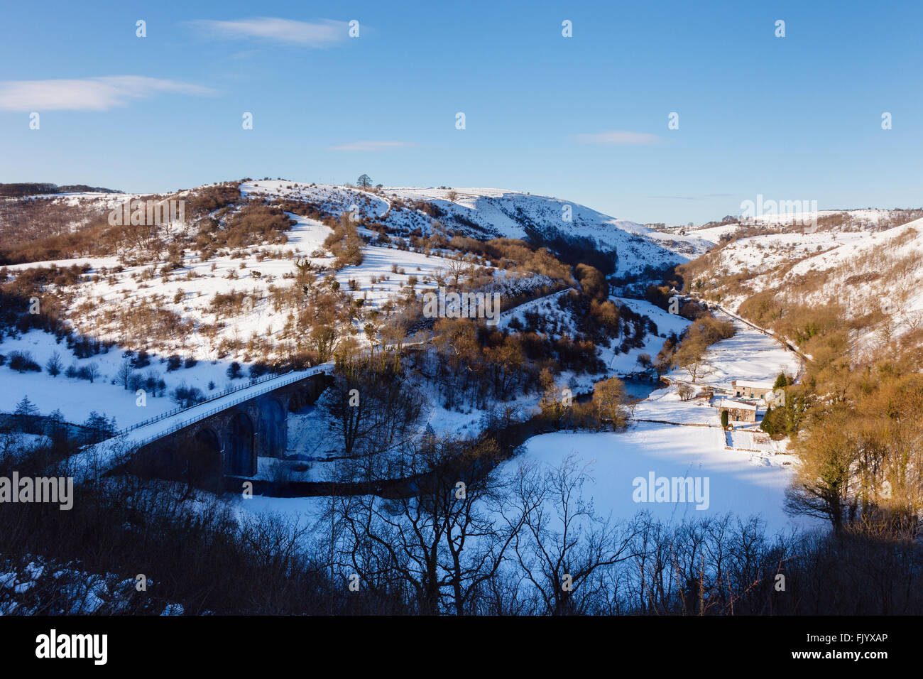 View from Monsal Head to Monsal Dale viaduct across valley with snow in ...