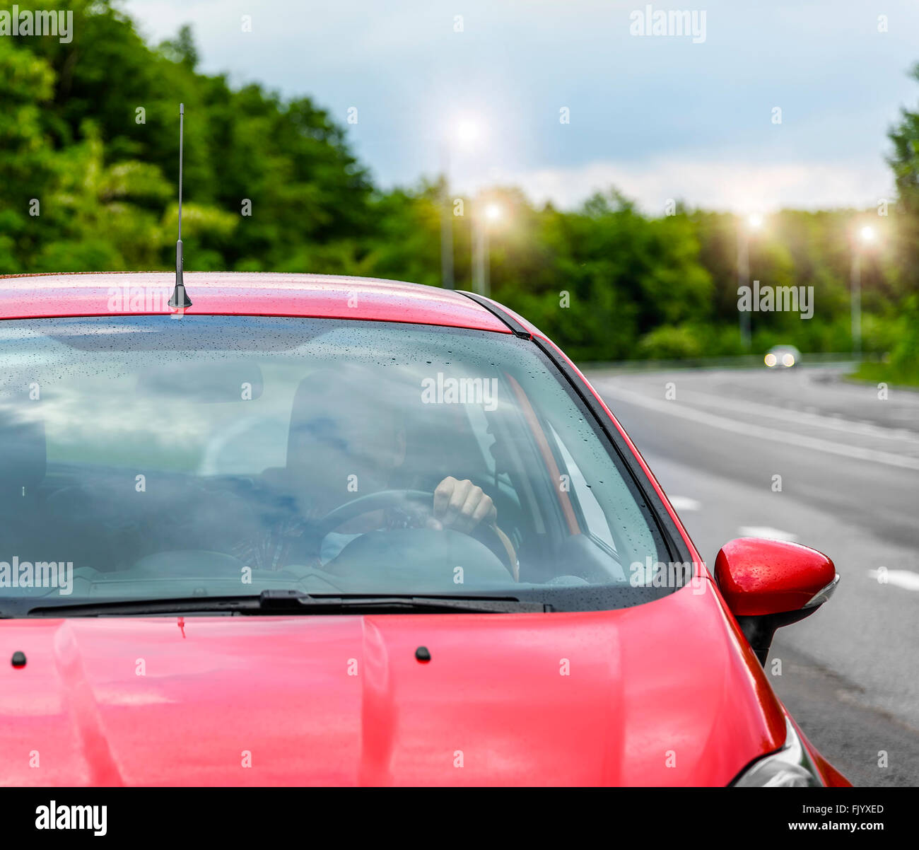 Red car on the road Stock Photo - Alamy
