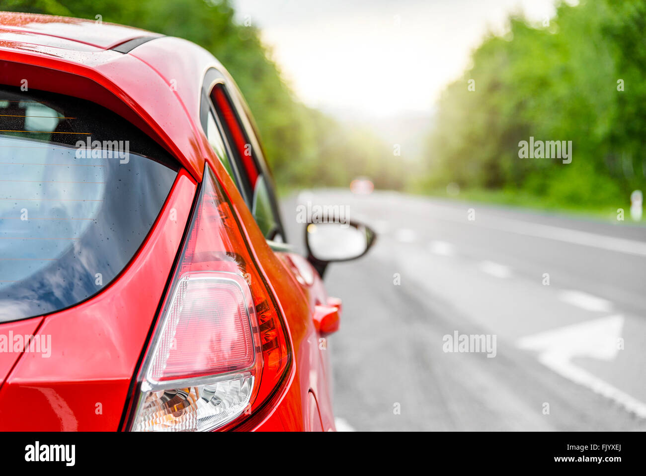 Red car on the road hi-res stock photography and images - Alamy