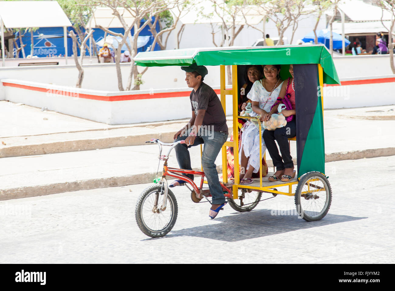 Rickshaw with passengers in Riohacha, Colombia Stock Photo - Alamy