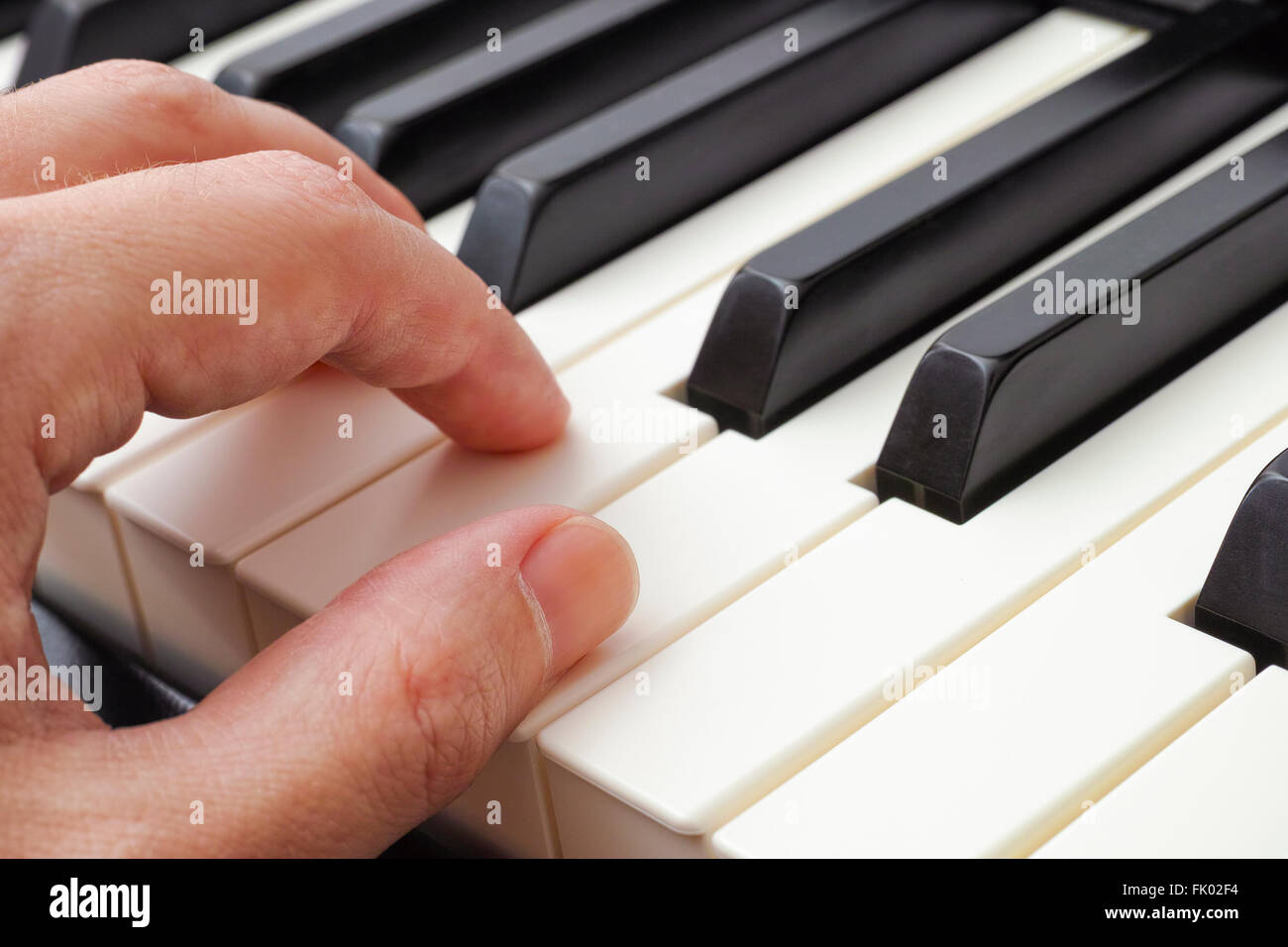 Man hands playing piano. Close up Stock Photo - Alamy