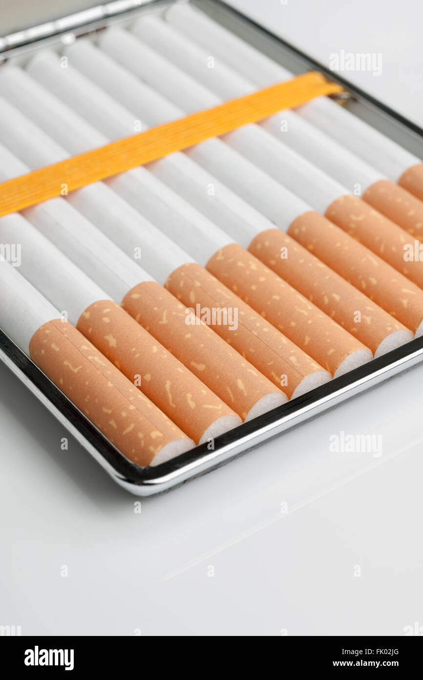 Cigarettes in a classic style cigarette case Stock Photo - Alamy