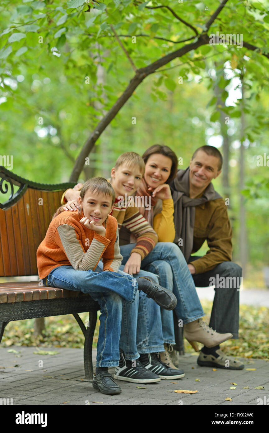 Family of four sitting Stock Photo - Alamy