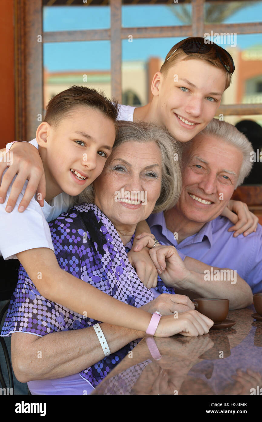 Happy family at table Stock Photo - Alamy