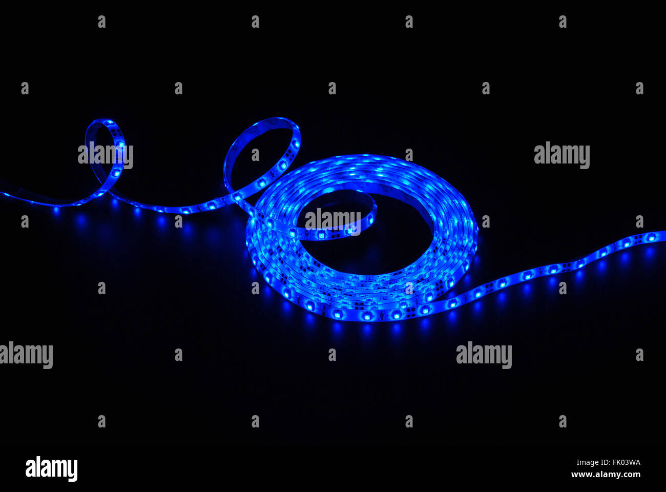 Blue led strip on the black background Stock Photo - Alamy