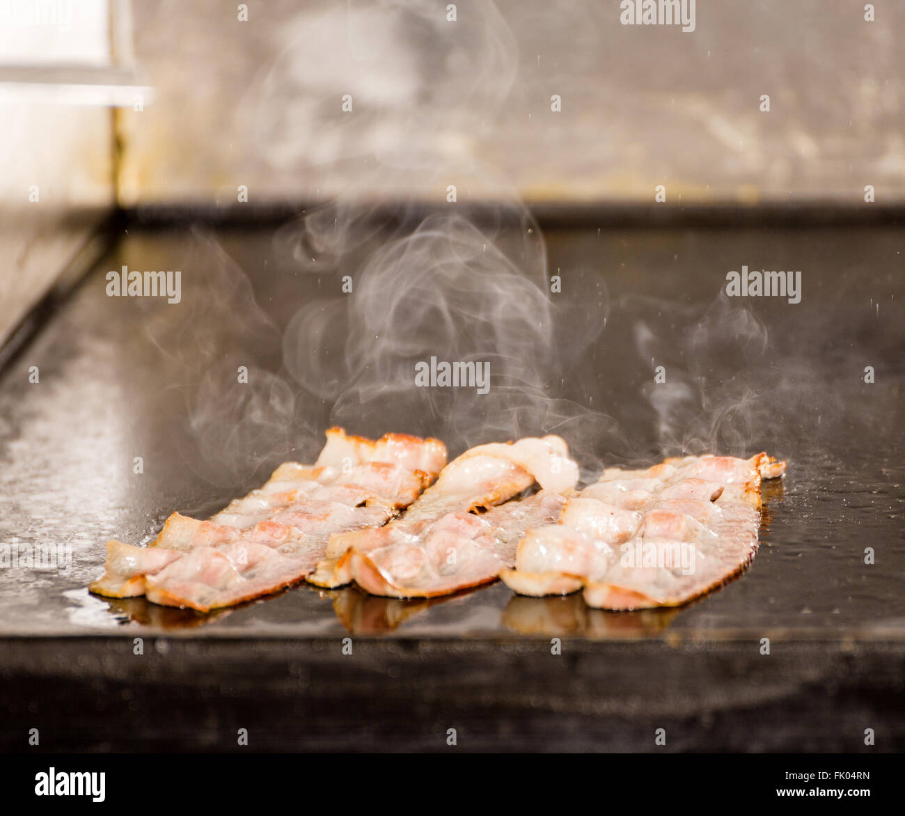Closeup of Tasty Fried Bacon Strips on Grilling Panel. Delicious Cooked ...