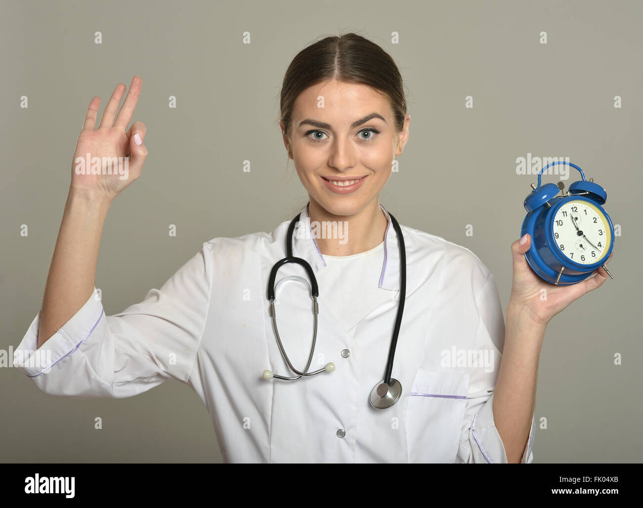 doctor with clock Stock Photo - Alamy