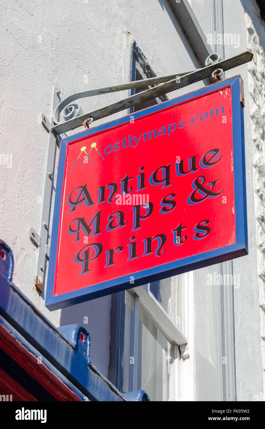 Bright red sign for Mostly Maps antique maps and prints shop in Hay-on ...
