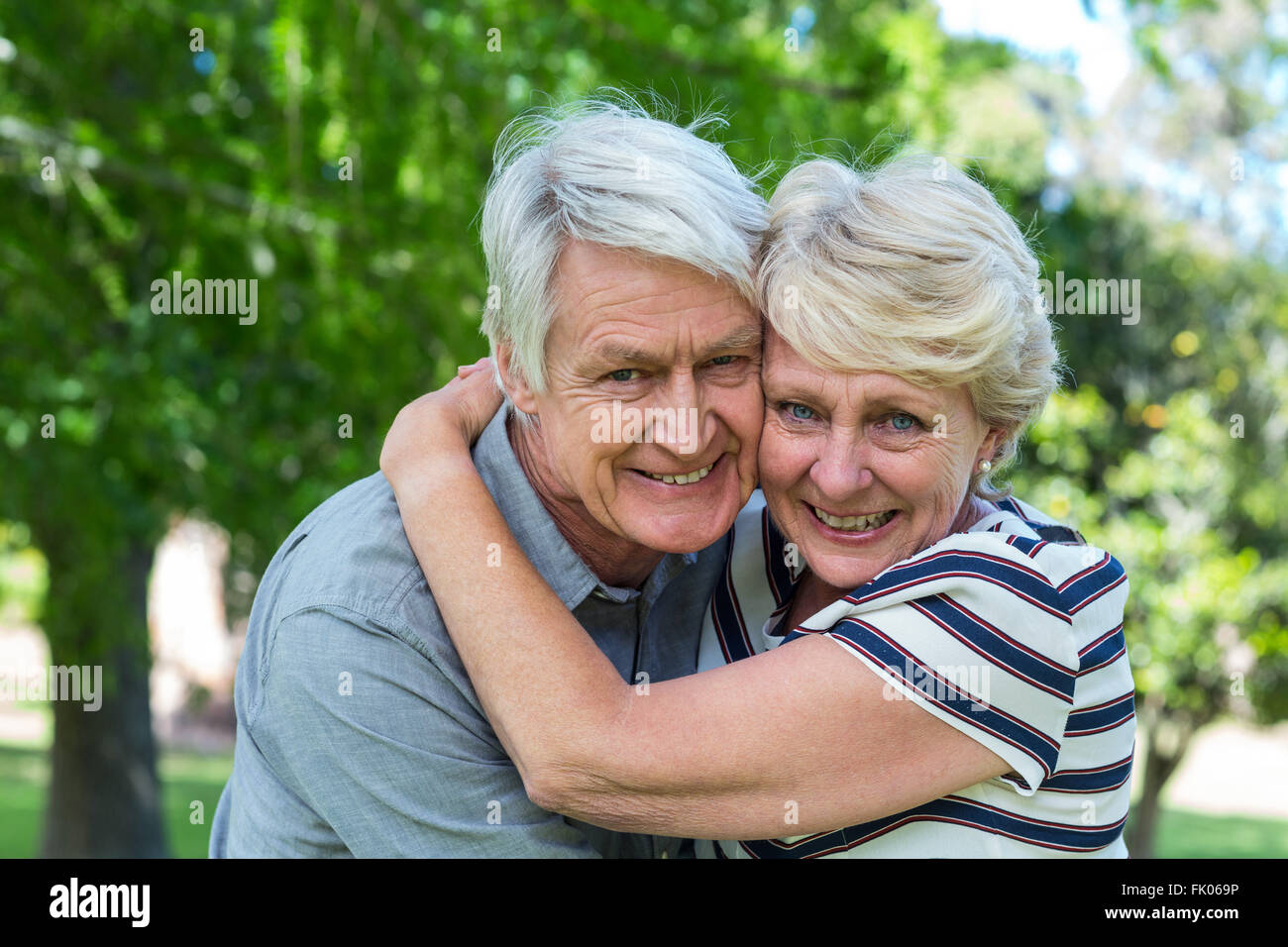 Senior couple embracing head to head Stock Photo - Alamy