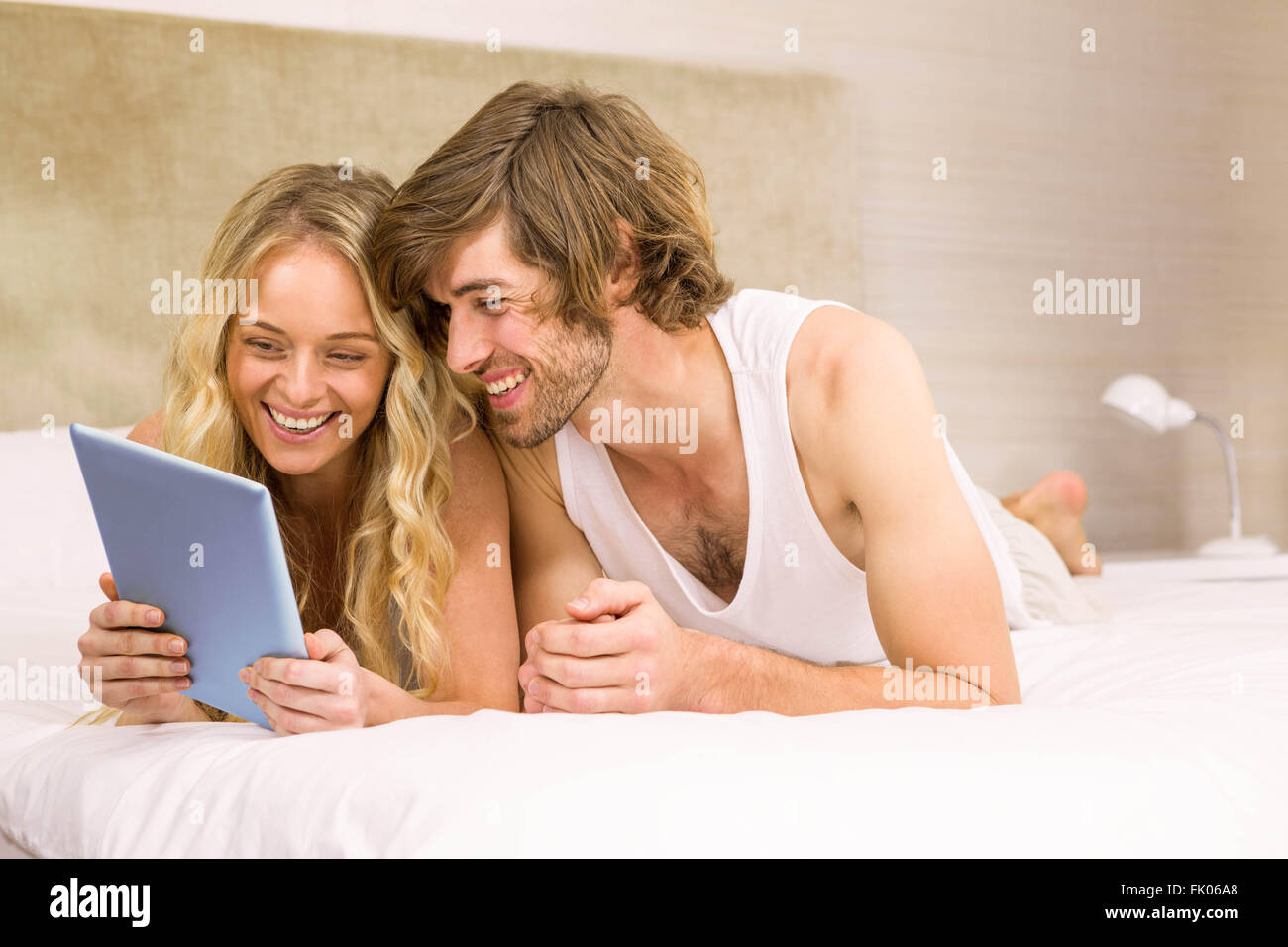 Cute couple using tablet hi-res stock photography and images - Alamy