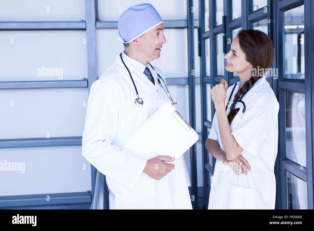 Doctors interacting with each other Stock Photo - Alamy