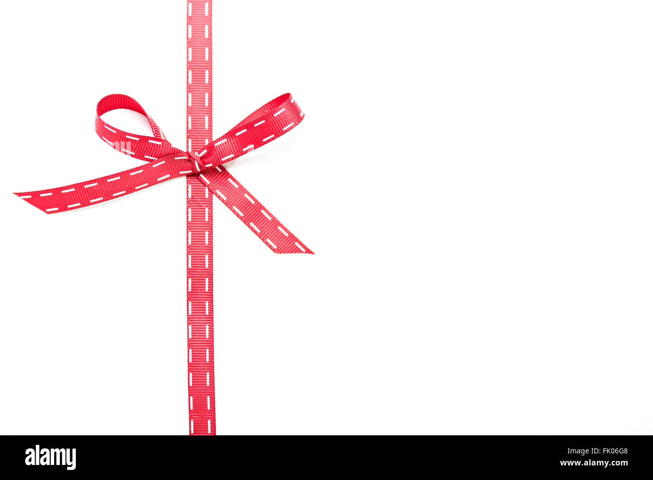 red ribbon and bow isolated on white background Stock Photo - Alamy