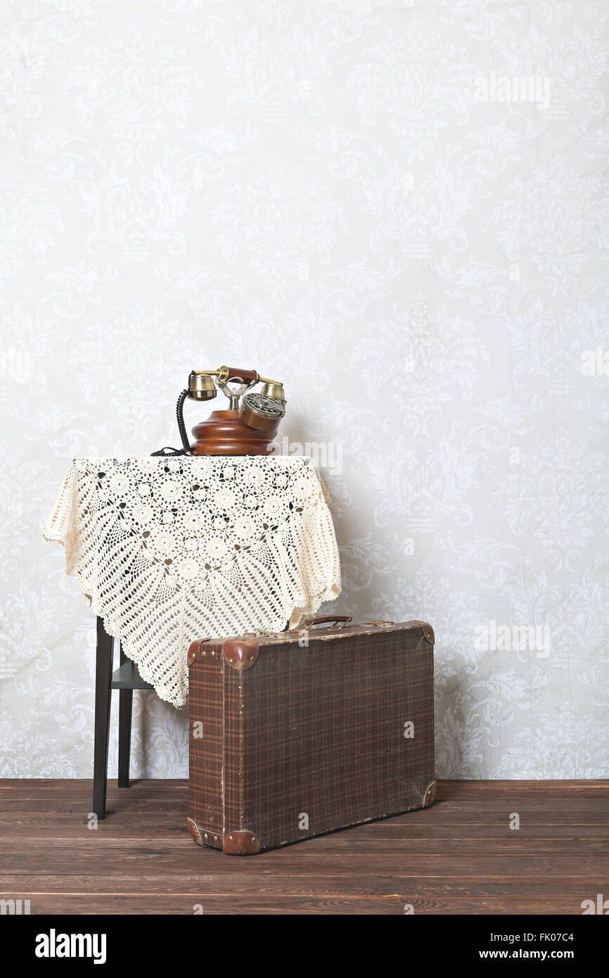 retro phone on the table on wallpaper background, vintage, copy space ...