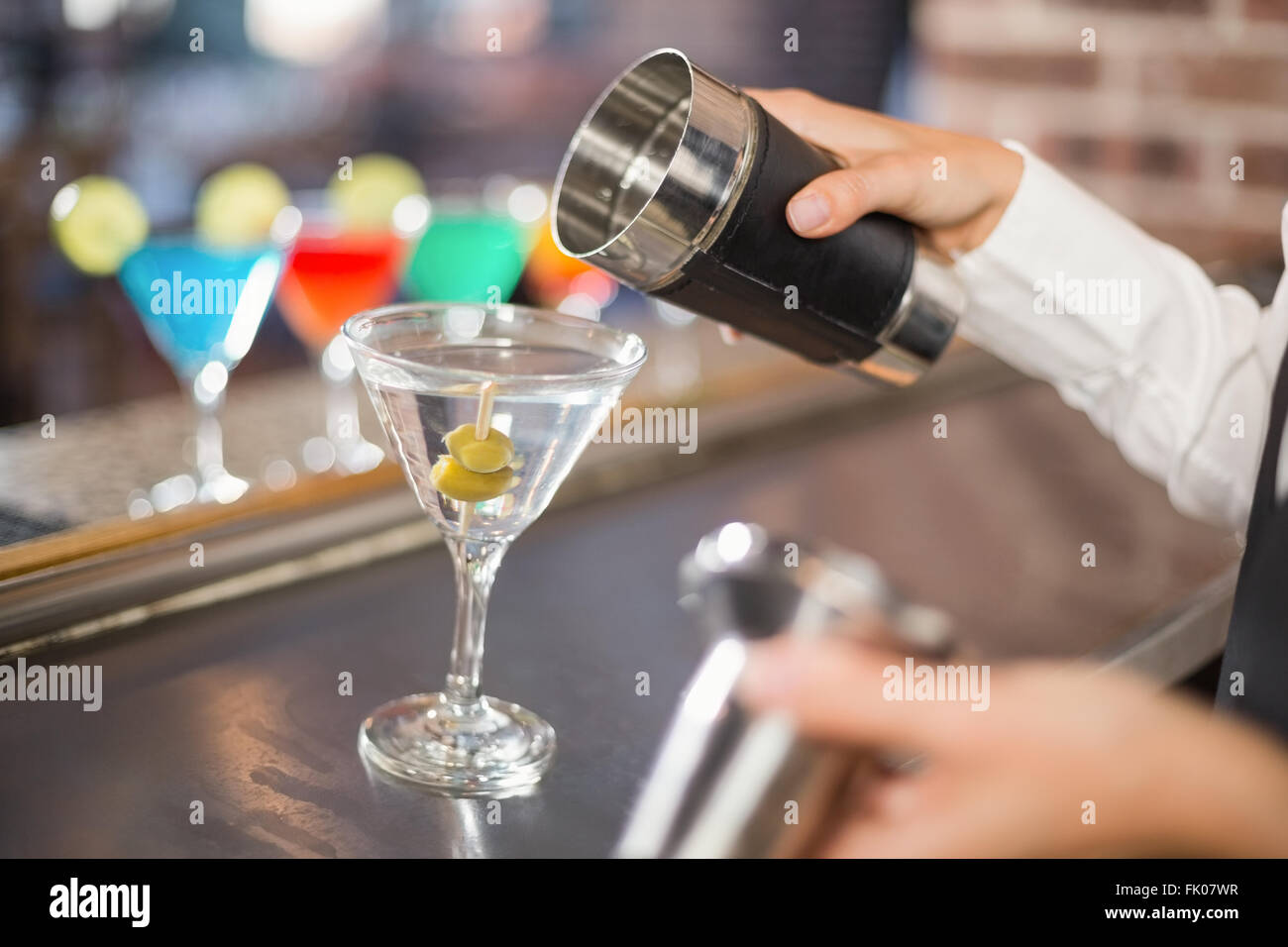 Bartender pouring cocktail Stock Photo - Alamy