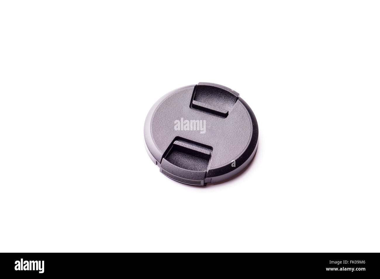 Black camera lens cover isolated Stock Photo - Alamy