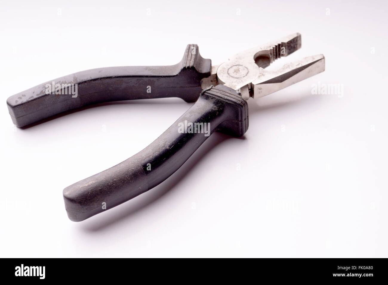 Old pliers isolated on white background Stock Photo - Alamy
