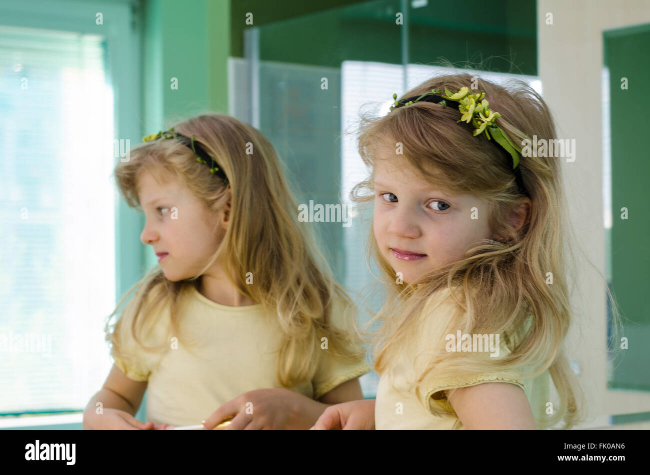 beautiful blond girl reflection in mirror Stock Photo - Alamy